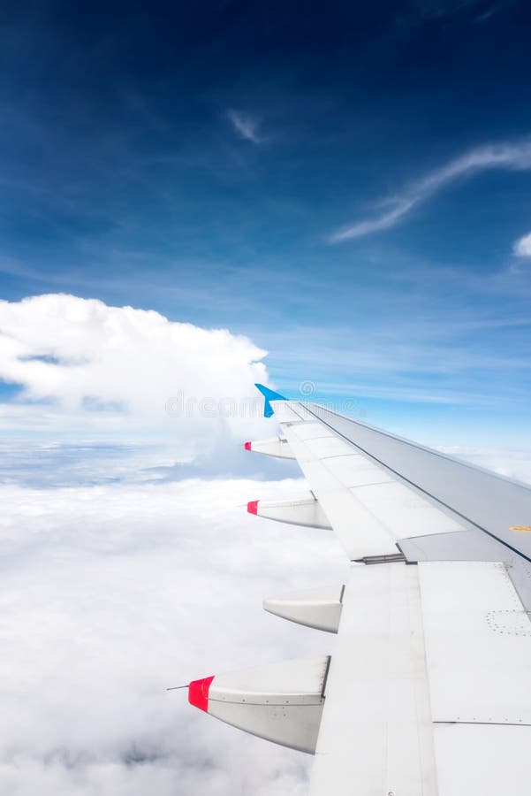 Wing of an airplane flying stock photo. Image of aeroplane - 83408324