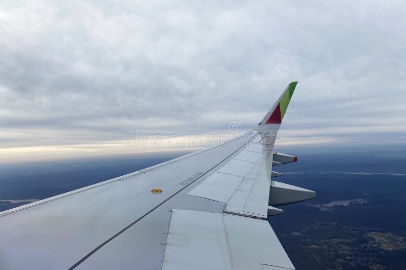 Wing of an Airplane Flying Above the Clouds. View from the Window ...