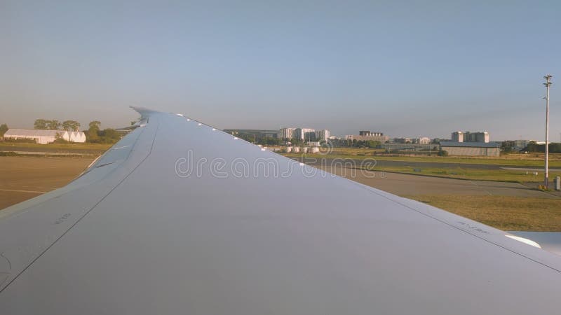 Wing of an Airplane Seen from the Passengers Window in an Airport Stock ...