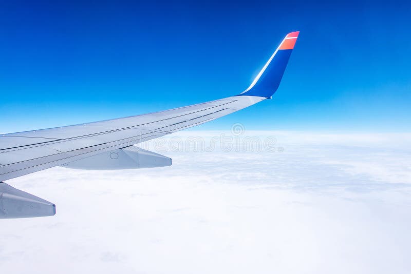 Wing of Airplane in the Sky Red Winglet Blue Sky Clouds Stock Photo ...