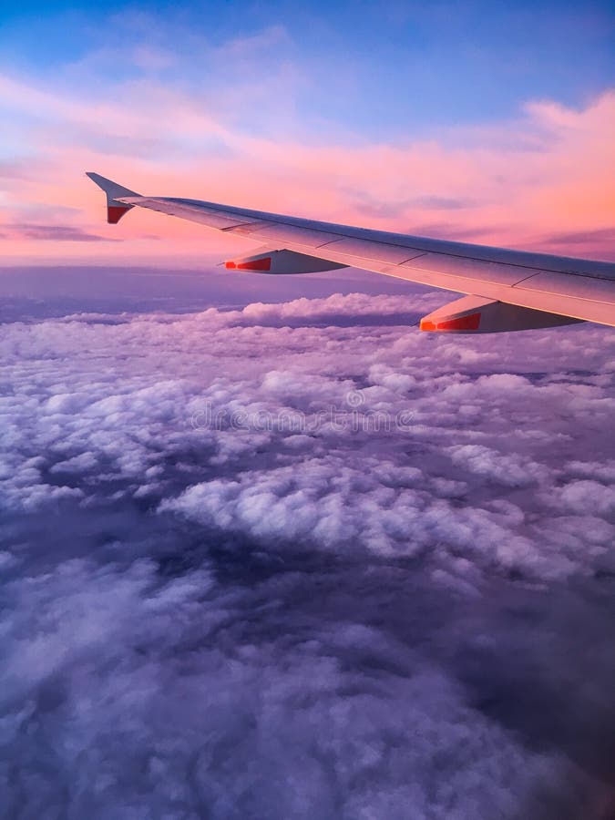 Wing of an Airplane at Sunset Stock Image - Image of orange, flight ...