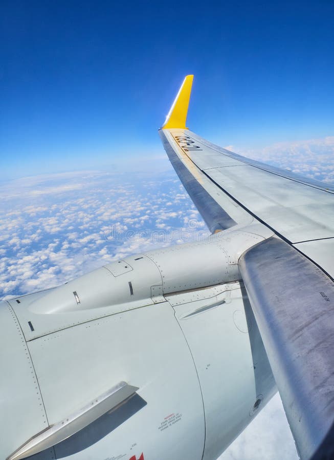 Wing and Engine of a Commercial Airplane in Flight. Editorial Stock ...