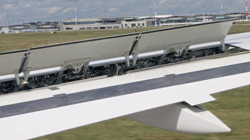 The Wing with Flaps of the Aircraft Working during the Landing Stock ...