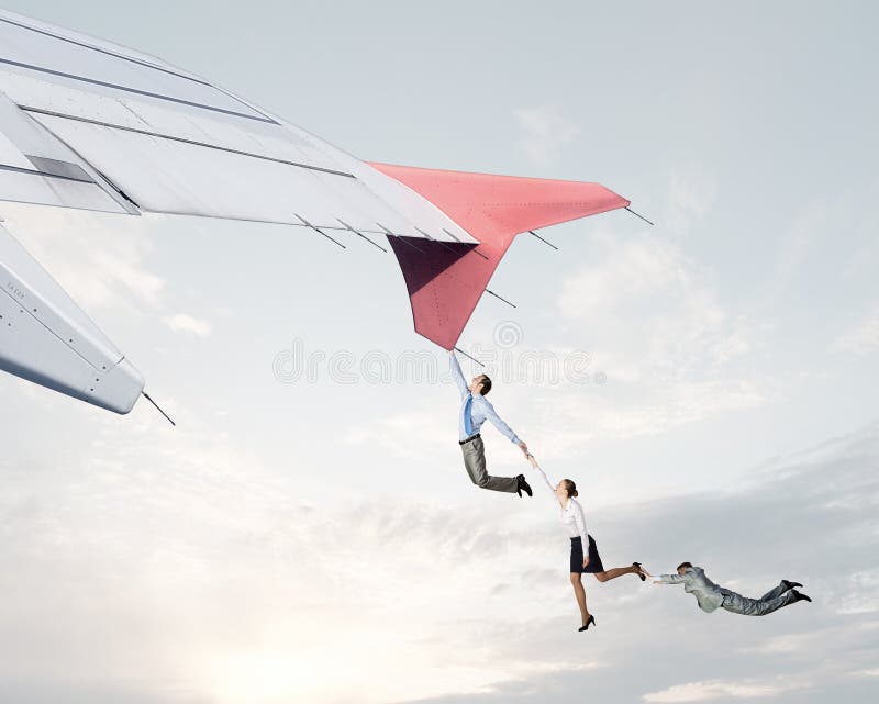 On wing of flying airplane stock photo. Image of success - 64152166
