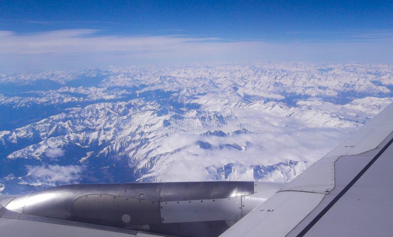 The Wing of a Plane and an Endless Sea of Italian Alps Stock Photo ...