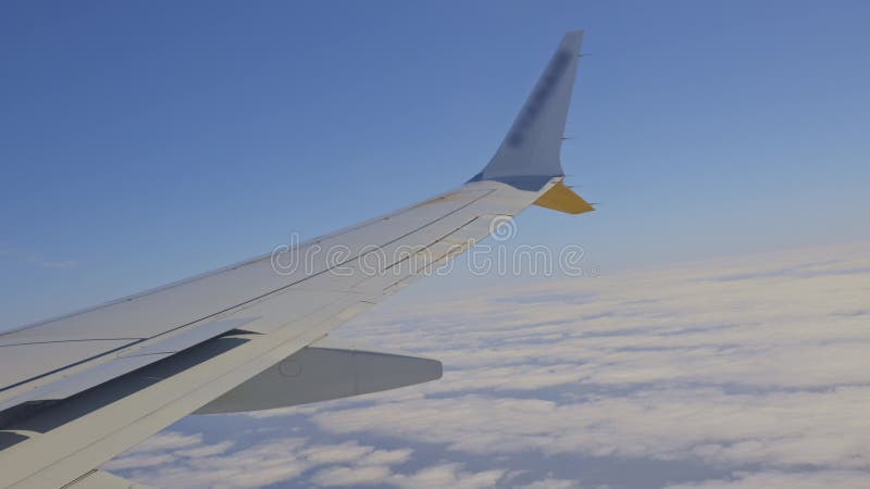 The Wing of a Plane is Seen in the Sky with Clouds Stock Footage ...