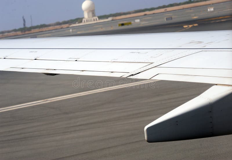 The Wing of a Take-off Airplane on the Background of the Airport Stock ...