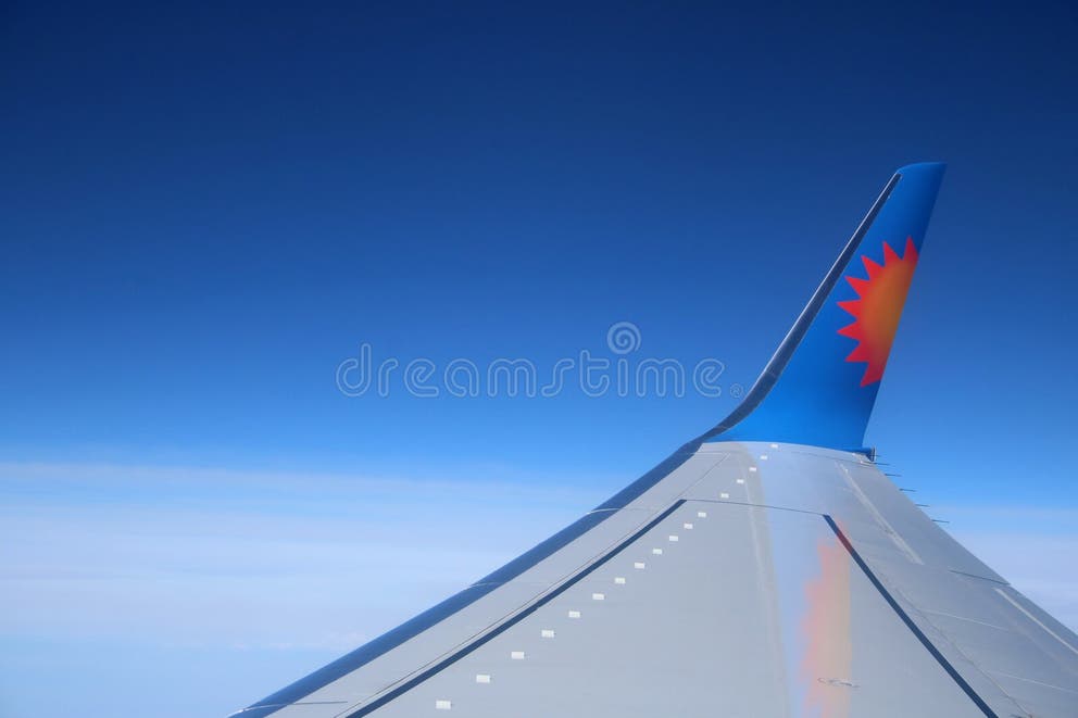Wing Tip Boeing 757 in Flight Against Blue Sky Editorial Photo - Image ...
