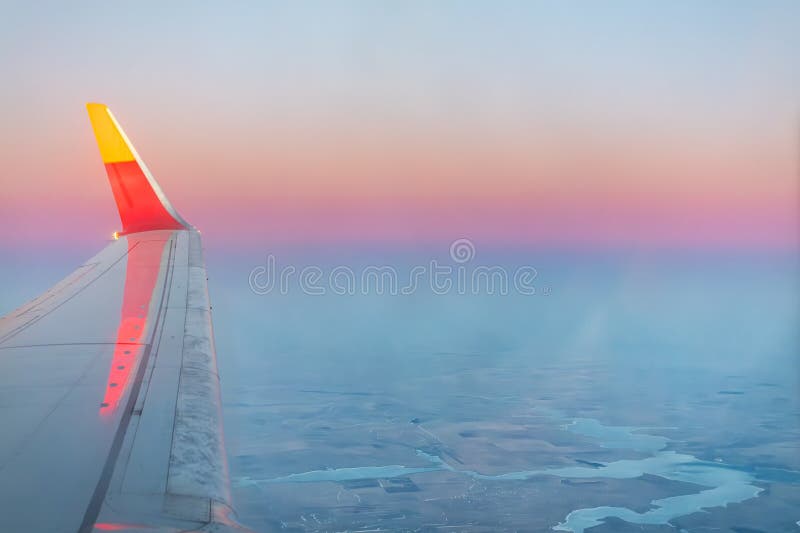 Wing View of Aircraft Flying in the Evening Time Stock Image - Image of ...