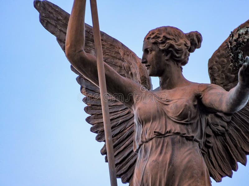 Winged Woman Statue stock photo. Image of blue, staff - 98774758