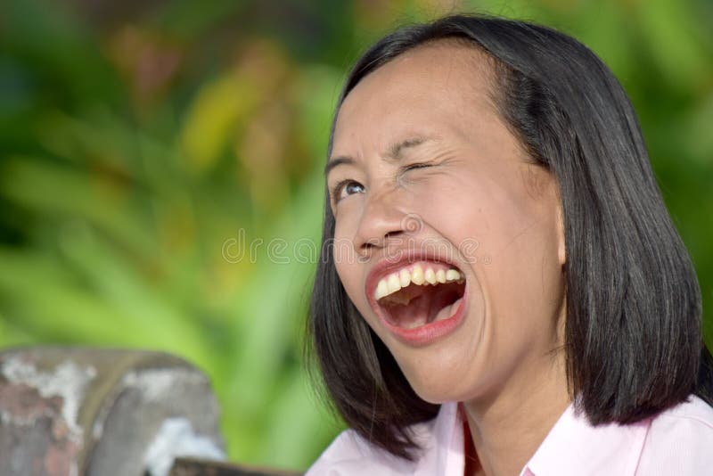 A Winking Diverse Female stock image. Image of winking - 154645211