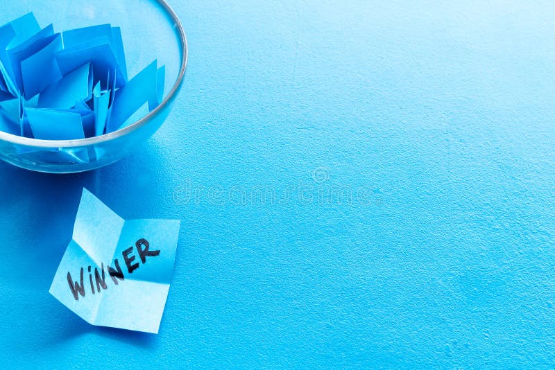 Winner Selection. Paper Pieces for Lottery in Vase on Blue Background ...
