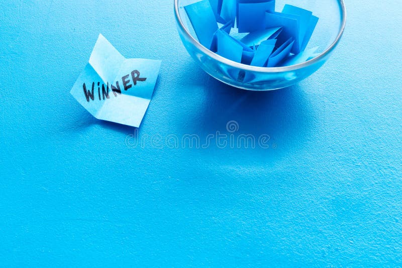 Winner Selection. Paper Pieces for Lottery in Vase on Blue Background ...
