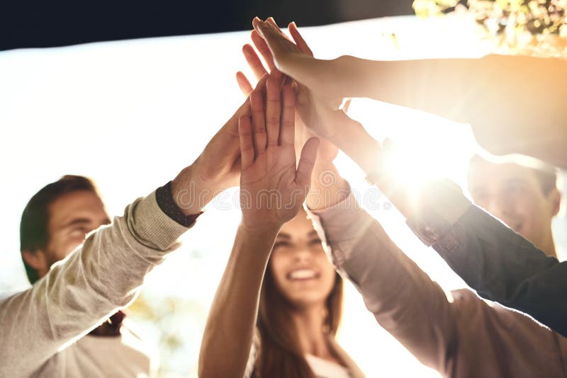 Winners Create Winning Teams. a Group of Colleagues Joining Hands in ... Winners Create Winning Teams. a Group of Colleagues Joining Hands in ...