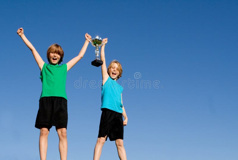Winners with cup or trophy stock photo. Image of excited - 4166086