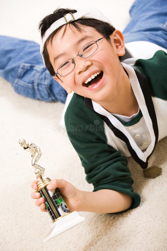 Winning Boy with His Medal and Trophy Stock Photo - Image of smiles ...