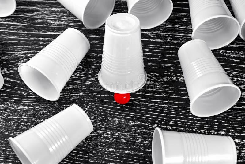 The Winning Cup in the Shell Game with a Prize Red Ball Stock Photo ...