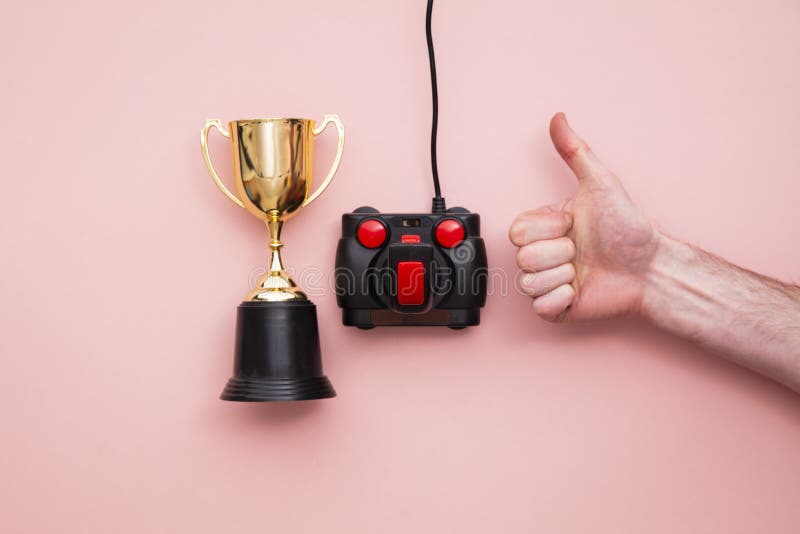 Winning Game Play. Retro Joystick Controller with Trophy and Thumbs Up ...