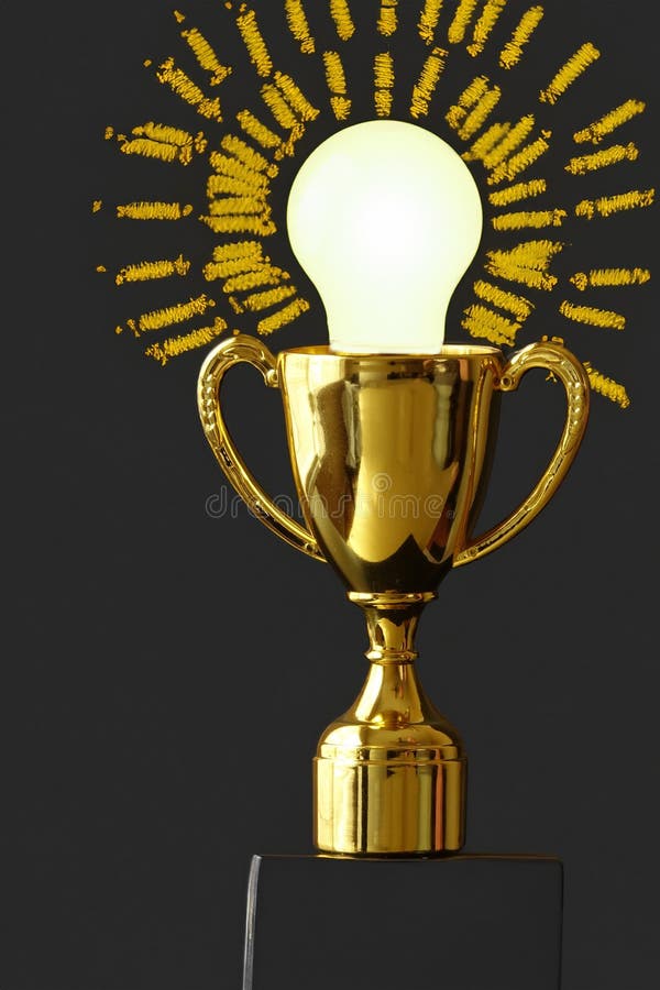 Winning Idea with a Gright Radiant Lightbulb and Gold Trophy Stock ...