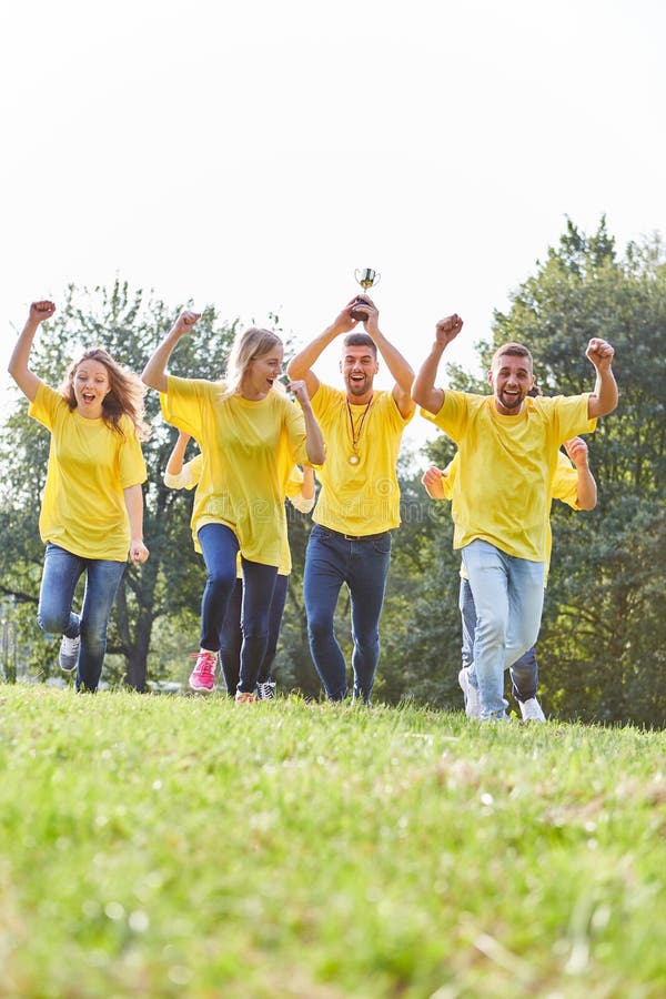Winning Team is Cheering with the Trophy Stock Image - Image of ...