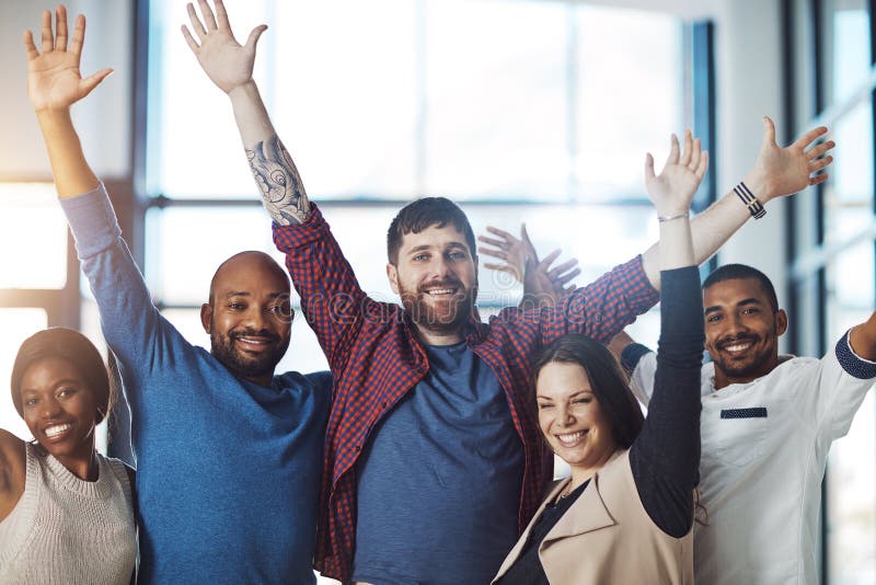 Winning is What we Do. Portrait of a Group of Young Colleagues Cheering ...