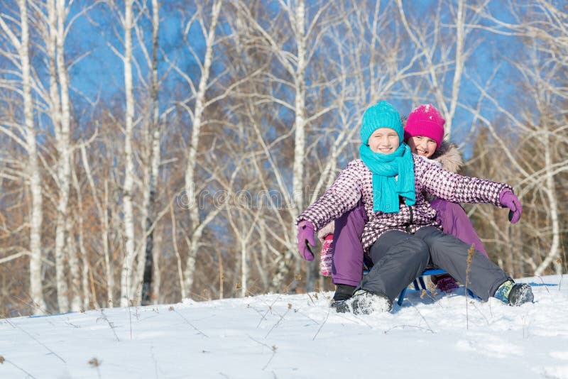 Winter activity stock image. Image of sled, laugh, recreation - 48111199