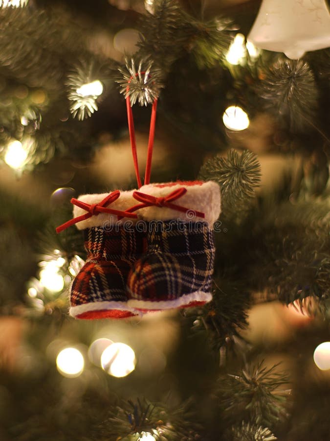 Winter Boots Christmas Ornament on Pine Tree Stock Image - Image of ...