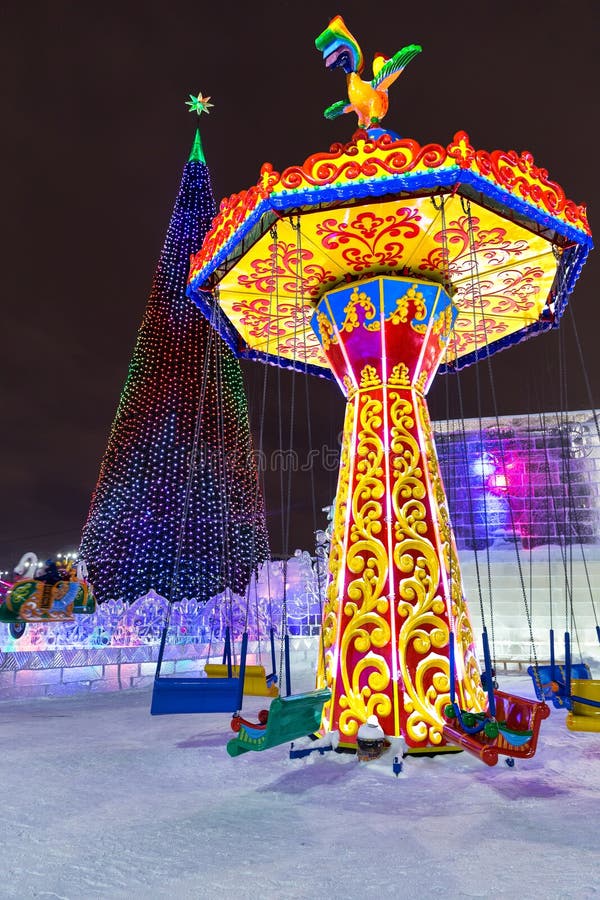 Old Carousel in the Park. Three Horses and a Plane on a Traditional ...