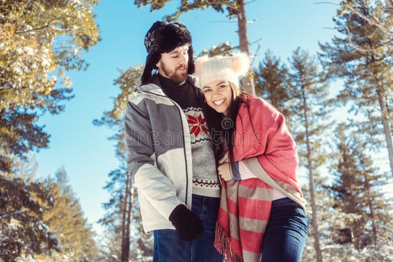 Winter Couple in the Forest Enjoying the Season Stock Photo - Image of ...