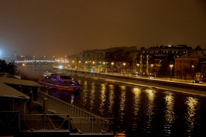 Winter Evening Boat Trip on the River in the Snowfall. Night Lights and ...