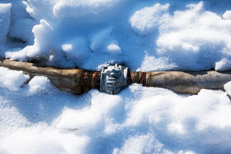 Everything is Covered with Snow. Leak in the Connection of Pipes ...
