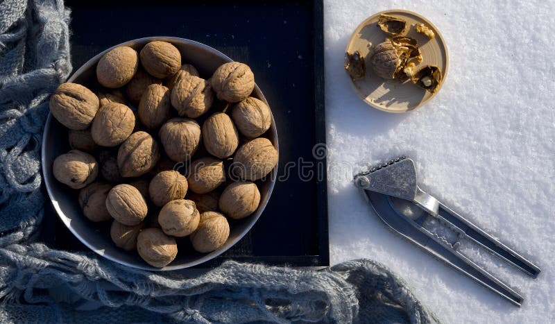 Winter Flat Lay with Walnut on Black Tray, Cracked Nut with Nutshell ...