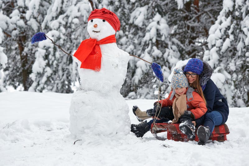 Winter Fun. a Girl and a Boy Making Snowballs. Stock Photo - Image of ...