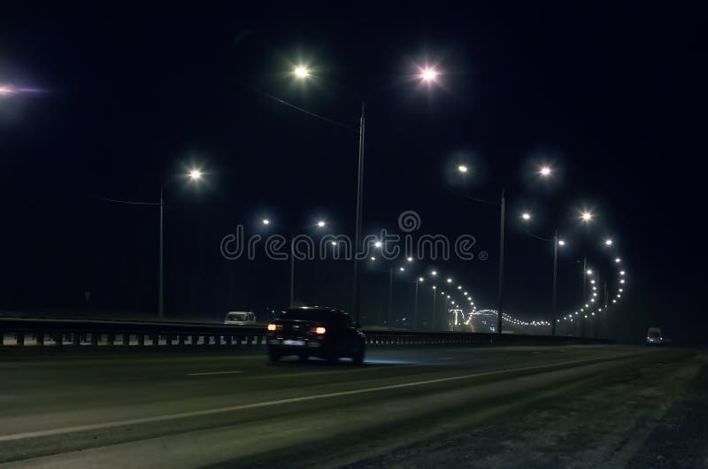 Winter highway at night stock image. Image of blue, lights - 138128369