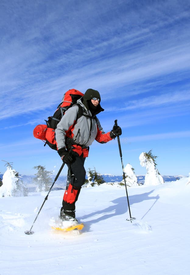 Winter Hiking in the Mountains on Snowshoes with a Backpack and Tent ...