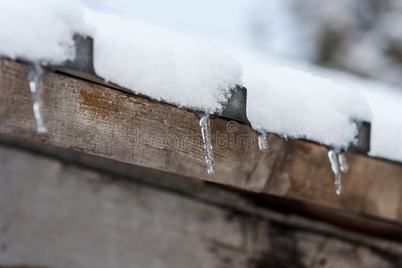 Winter Icicles Hanging from Eaves of Roof Backgrouind Stock Photo ...