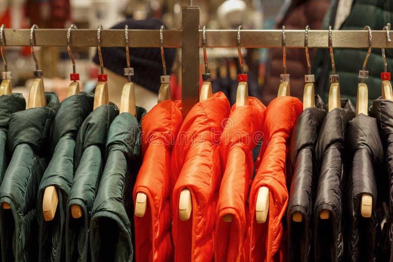 Winter Jackets on a Hanger in the Store Close-up Stock Image - Image of ...