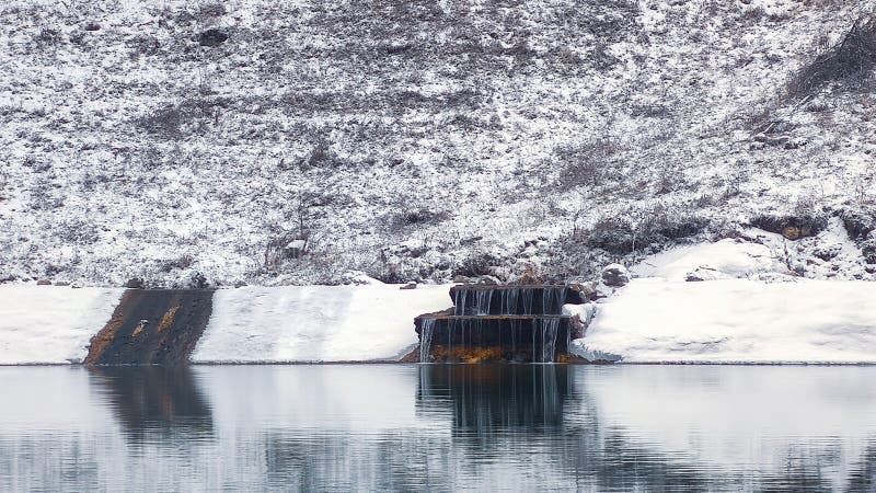 A Winter Lake into Which Water Flows Down the Steps. Stock Image ...