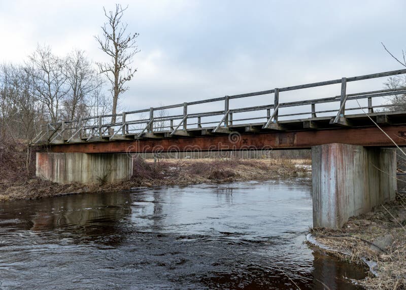 Winter Landscape with a Bridge Over a Rapid River Stock Image - Image ...