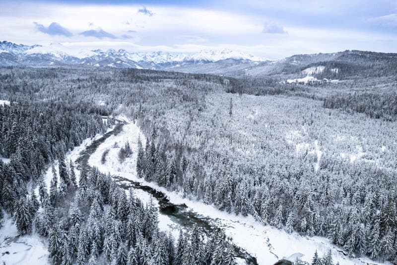 Winter Landscape with Frozen River and Snowy Mountains, Drone View ...