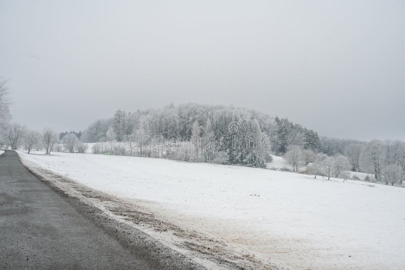 Winter Landscape with Road in Front, Forest in the Distance with Lots ...