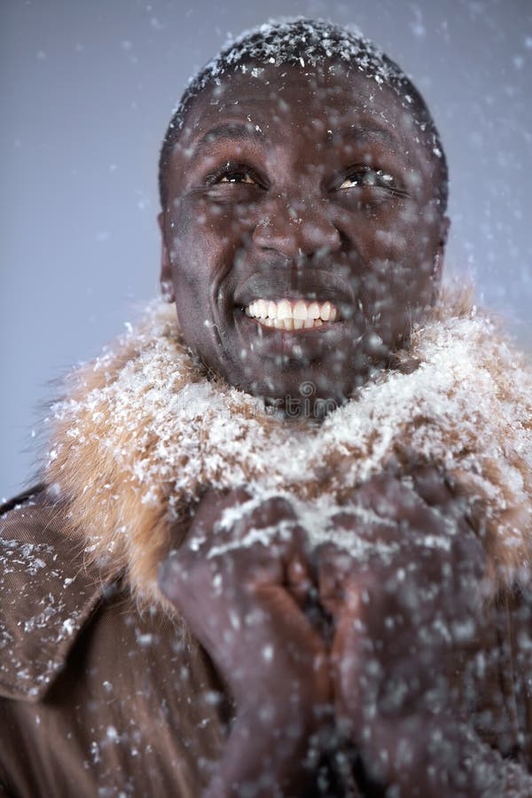 Frozen Young Man of African Ethnicity Looking at Camera Stock Photo ...