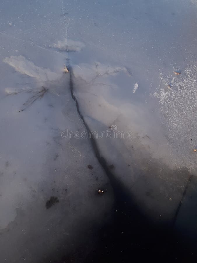 Crack in Ice. Ice is Melting and Cracking. Stock Photo - Image of ...