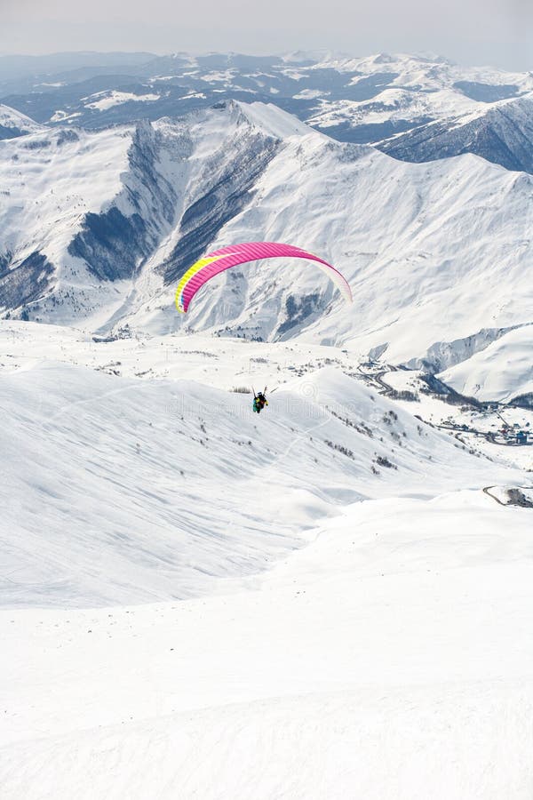 Winter Paragliding Over Mountain Peaks Stock Photo - Image of lift ...