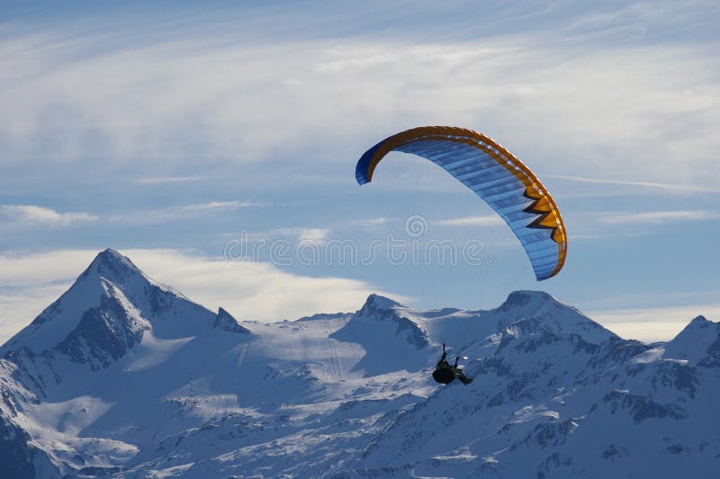 Winter Paragliding Over Mountain Peaks Stock Photo - Image of lift ...
