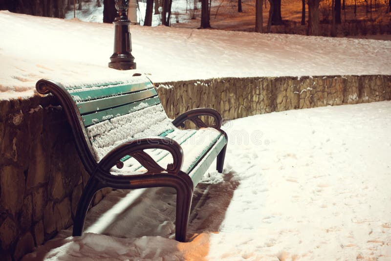 Winter Park.green Bench Covered with Snow in the Stock Image - Image of ...