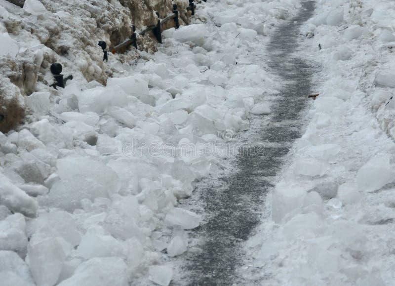 Winter Path on the Iced Over Pavement Stock Image - Image of chunks ...