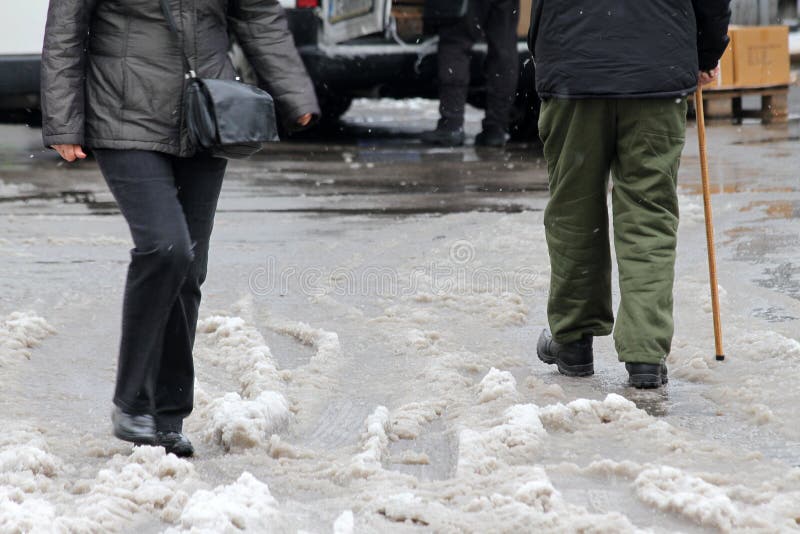 Winter. People Walk on a Very Snowy Sidewalk and Road. People Step on ...