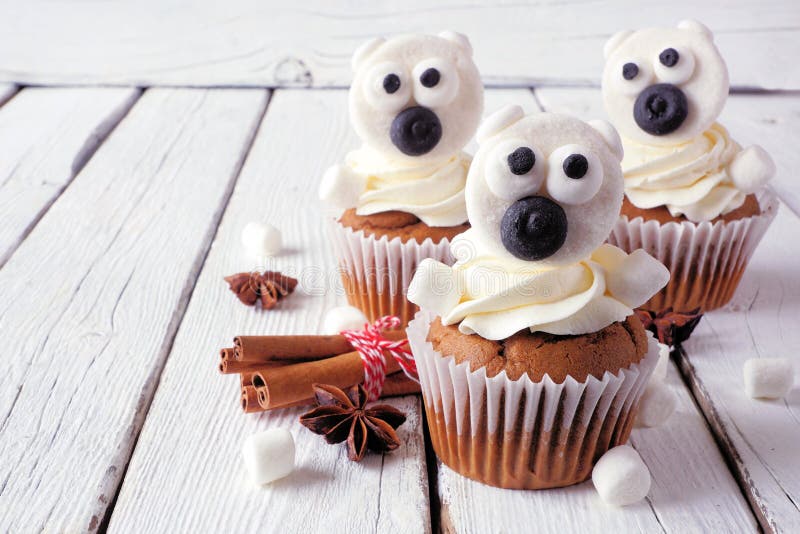 Winter Polar Bear Cupcakes on a Rustic White Wood Table Stock Photo ...