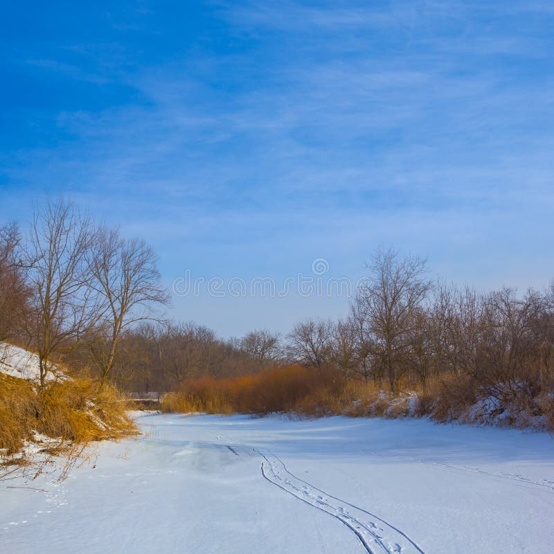 Winter River Under a Blue Cloudy Sky Stock Photo - Image of landscape ...